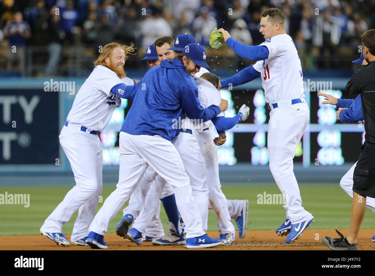 Los Angeles, CA, USA. 9th May, 2017. Dodger teammates cheer and pour ...