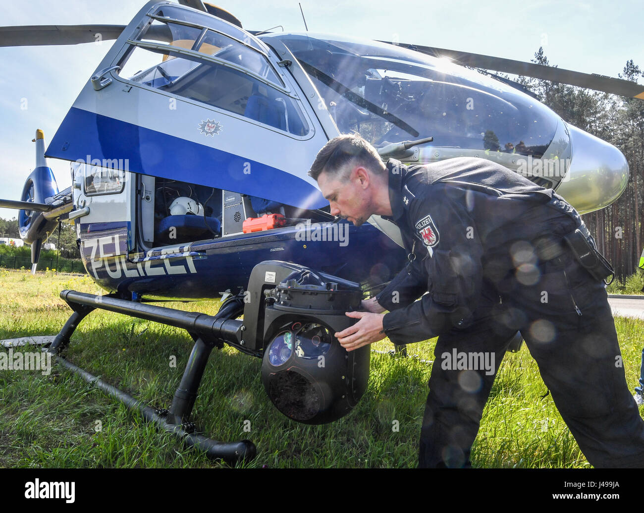Briesen, Germany. 11th May, 2017. Police officer Andreas Boecker points ...