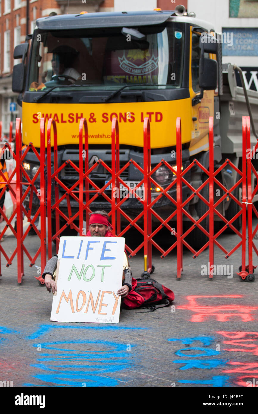 London, UK. 11th May, 2017. 'Life Not Money' activist and divestment ...