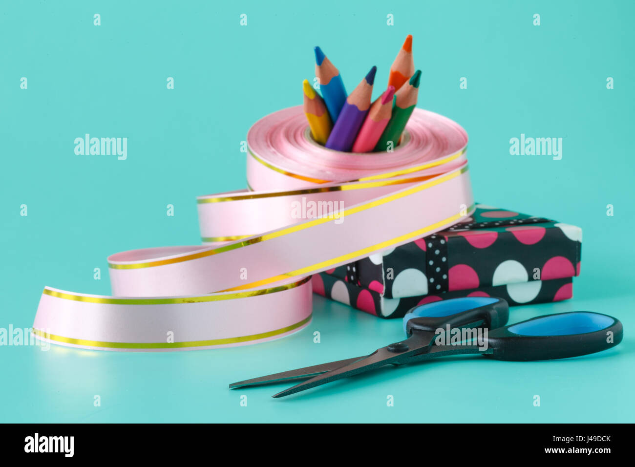 Rolls of gift wrapping paper and rolls of ribbon Stock Photo - Alamy