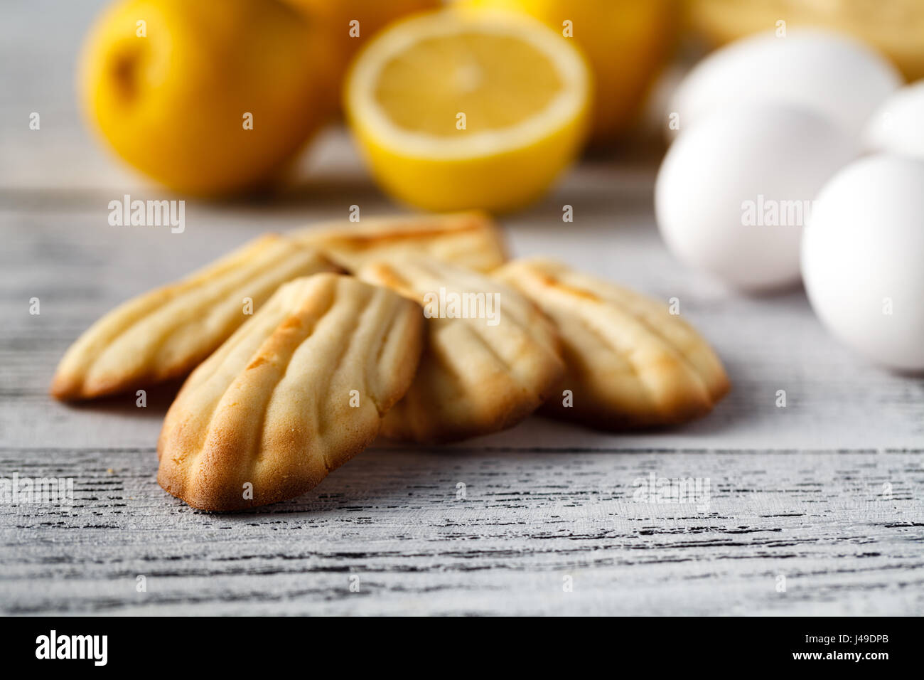 ingredients and tools to make a madeleine Stock Photo - Alamy