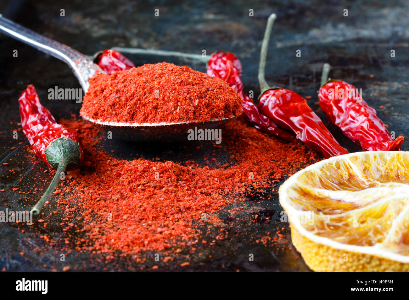 Vibrant red mexican hot chilli pepper, whole and grounded Stock Photo ...