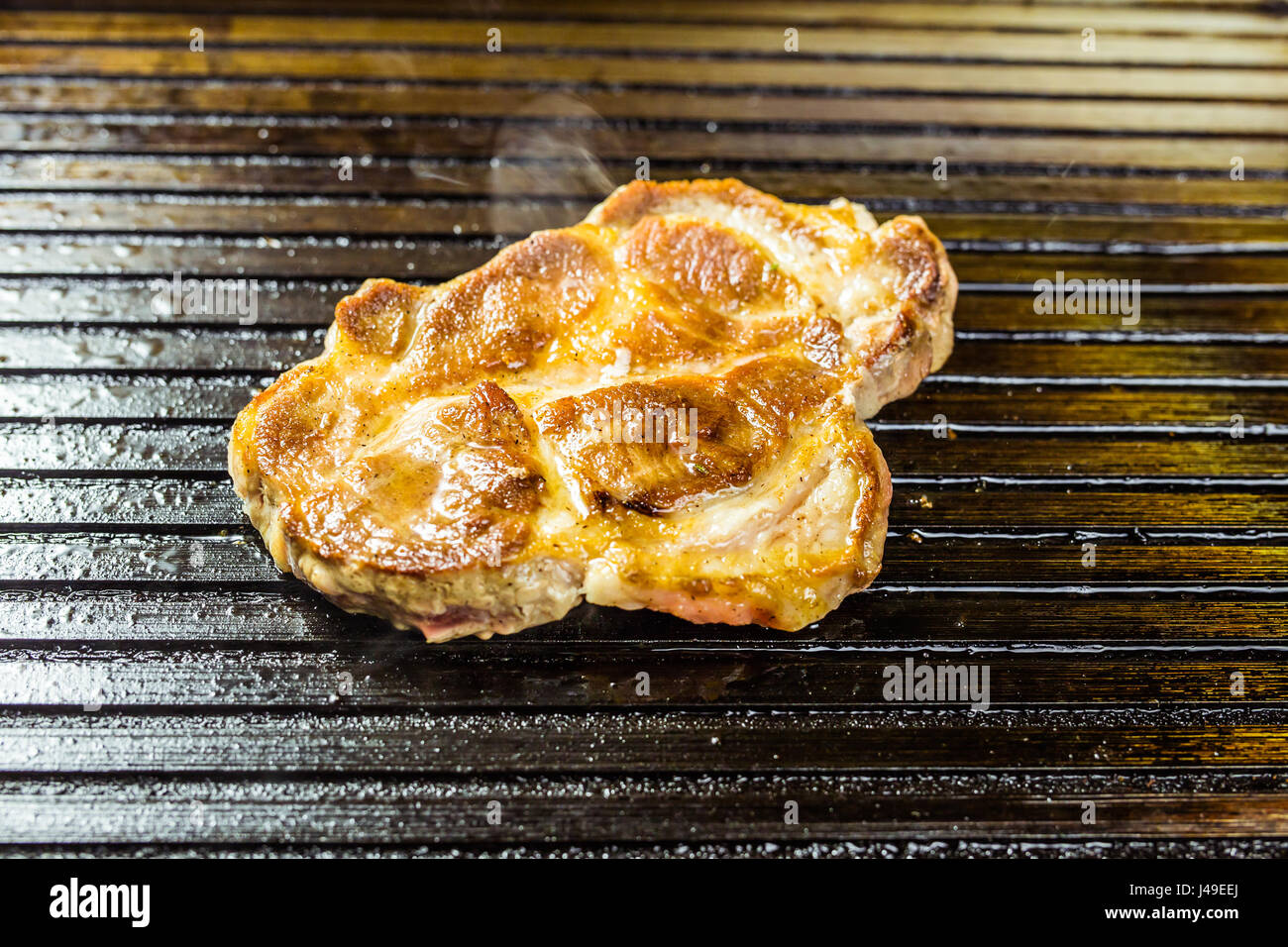 Grilled beef steak on the grill, close-up Stock Photo - Alamy