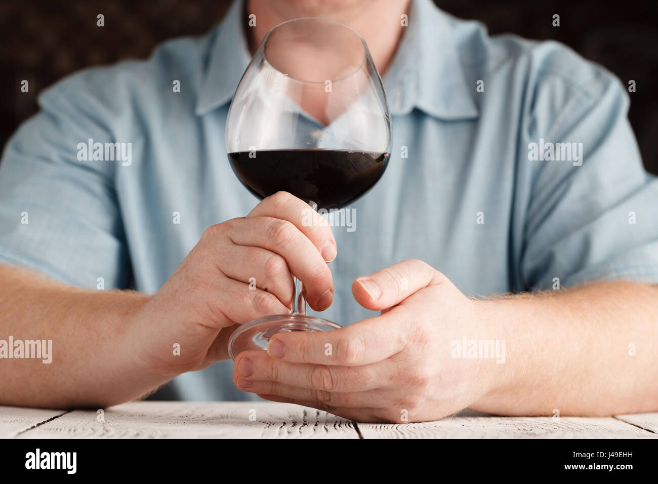 Man sniffing red wine in a glass, close up Stock Photo - Alamy