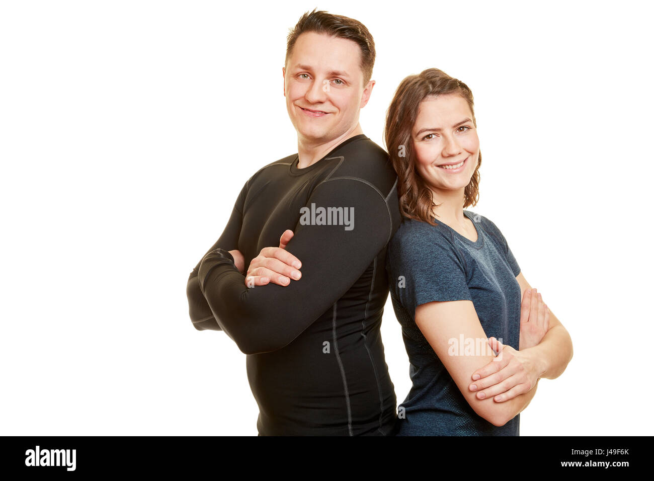 Two people as fitness couple smiling and leaning on each other Stock ...