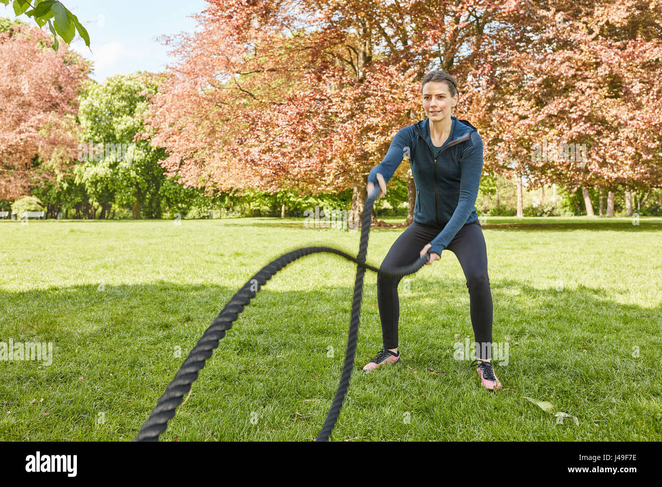 battle rope training as functional fitness at the park Stock Photo - Alamy