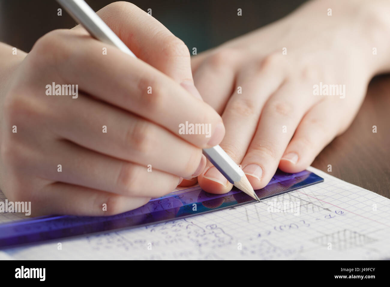 Girl writes in a notebook mathematical formulas Stock Photo - Alamy Girl writes in a notebook mathematical formulas Stock Photo - Alamy