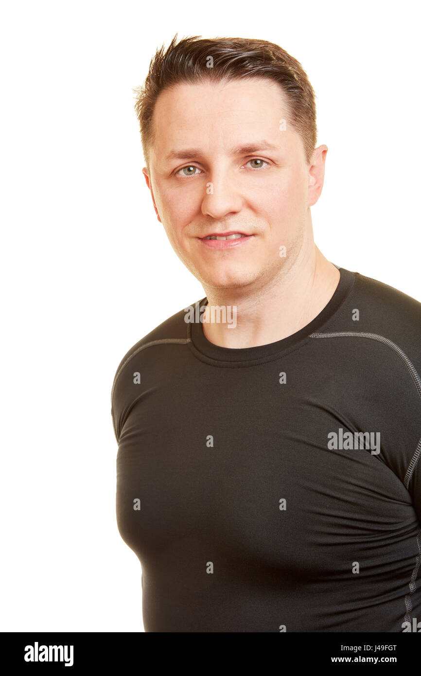Strong young man as bodybuilder smiles to the camera Stock Photo - Alamy