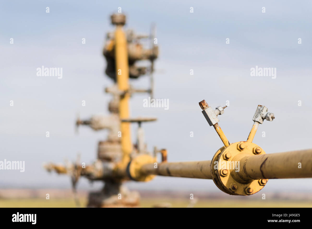 Old gas pipeline in the middle of the field. Extraction of gas from ...
