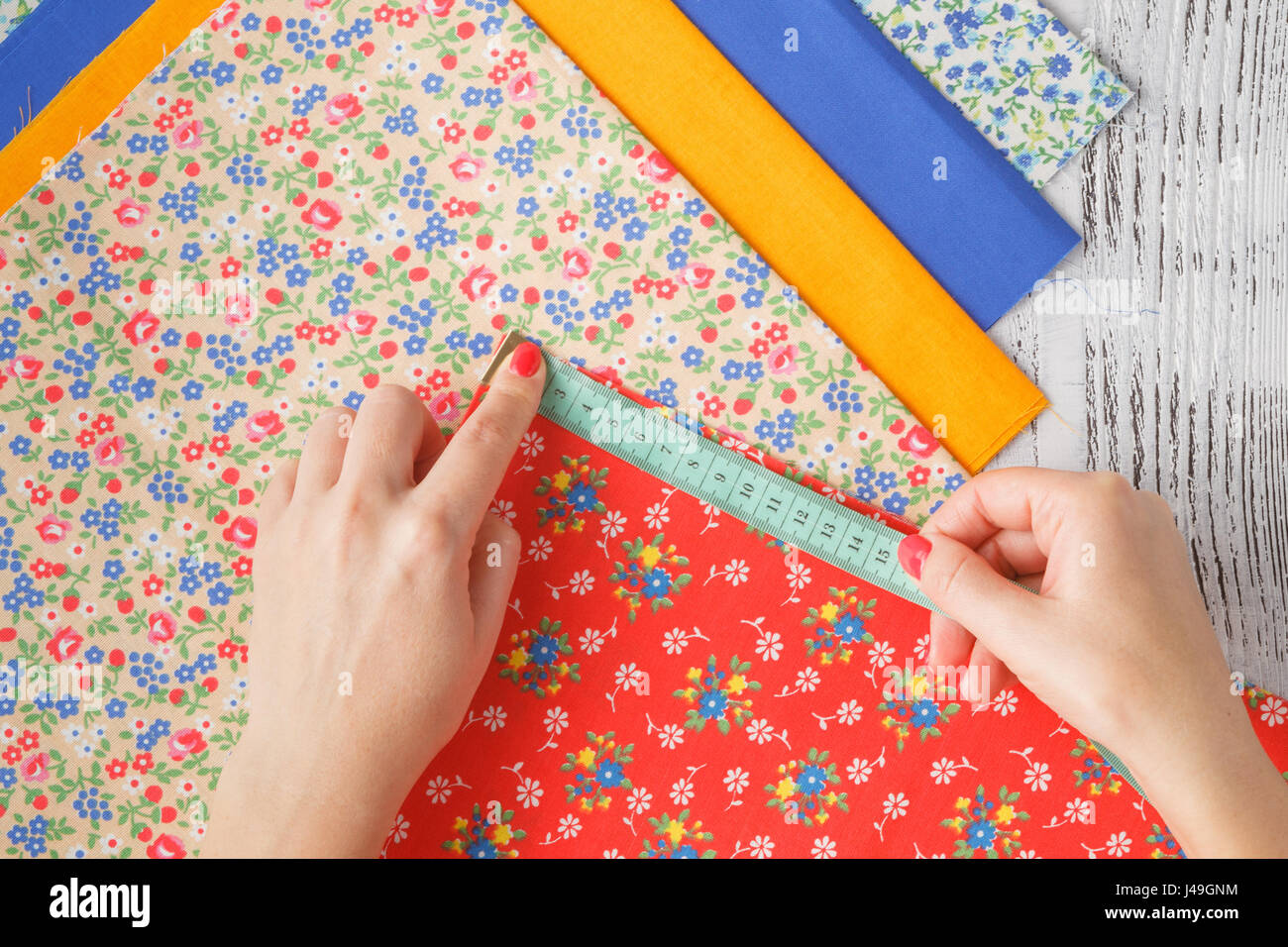 Still life photo of a suit pattern template with tape measure, chalk ...