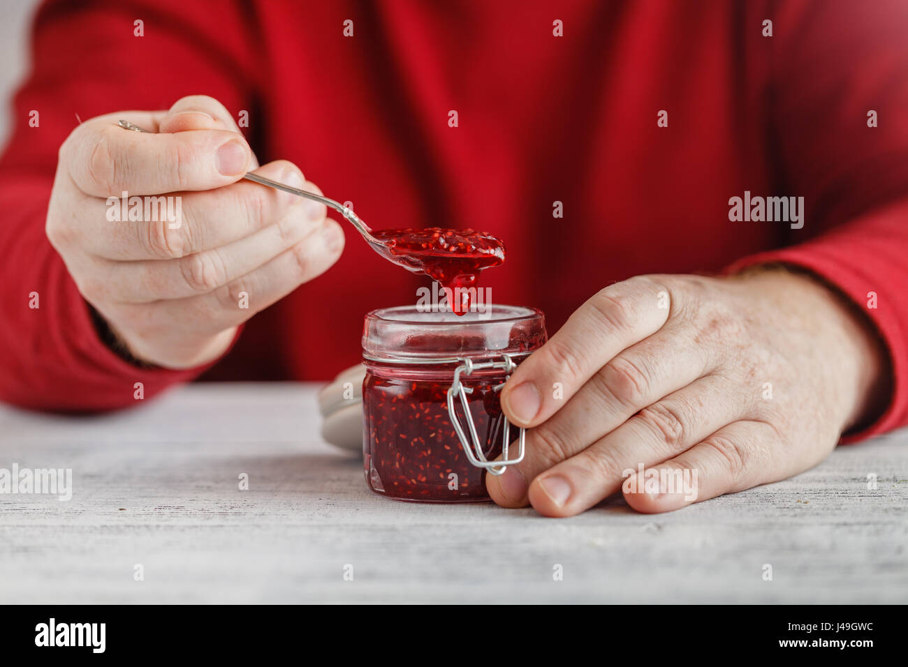 Jar with raspberry jam Stock Photo - Alamy