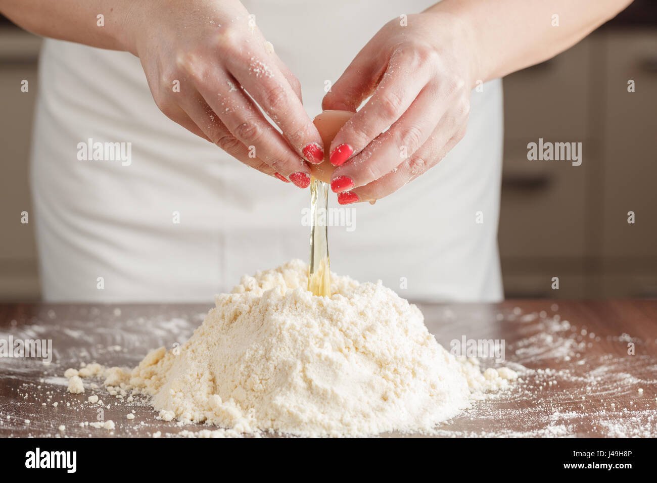 Making Pastry Dough for Hungarian Cake. Series. A baker mixing flour ...