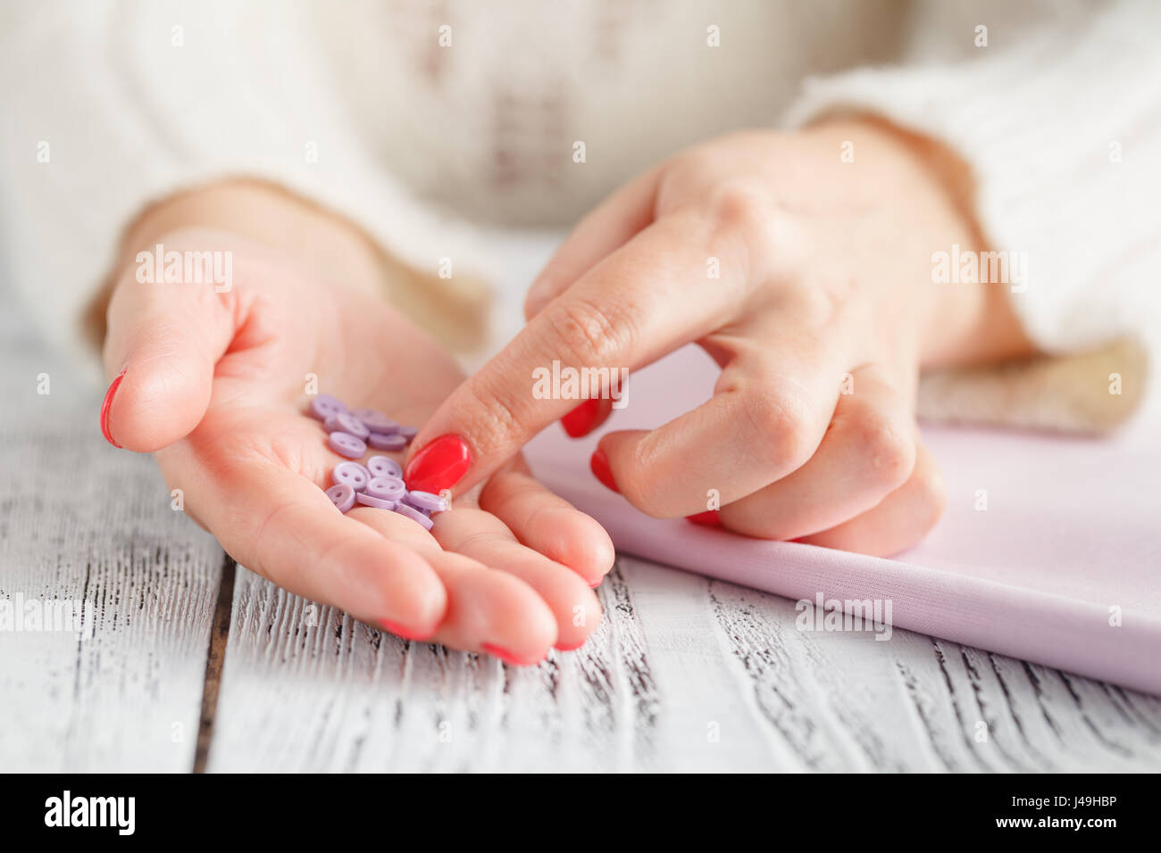 Hands full colorful buttons hi-res stock photography and images - Alamy