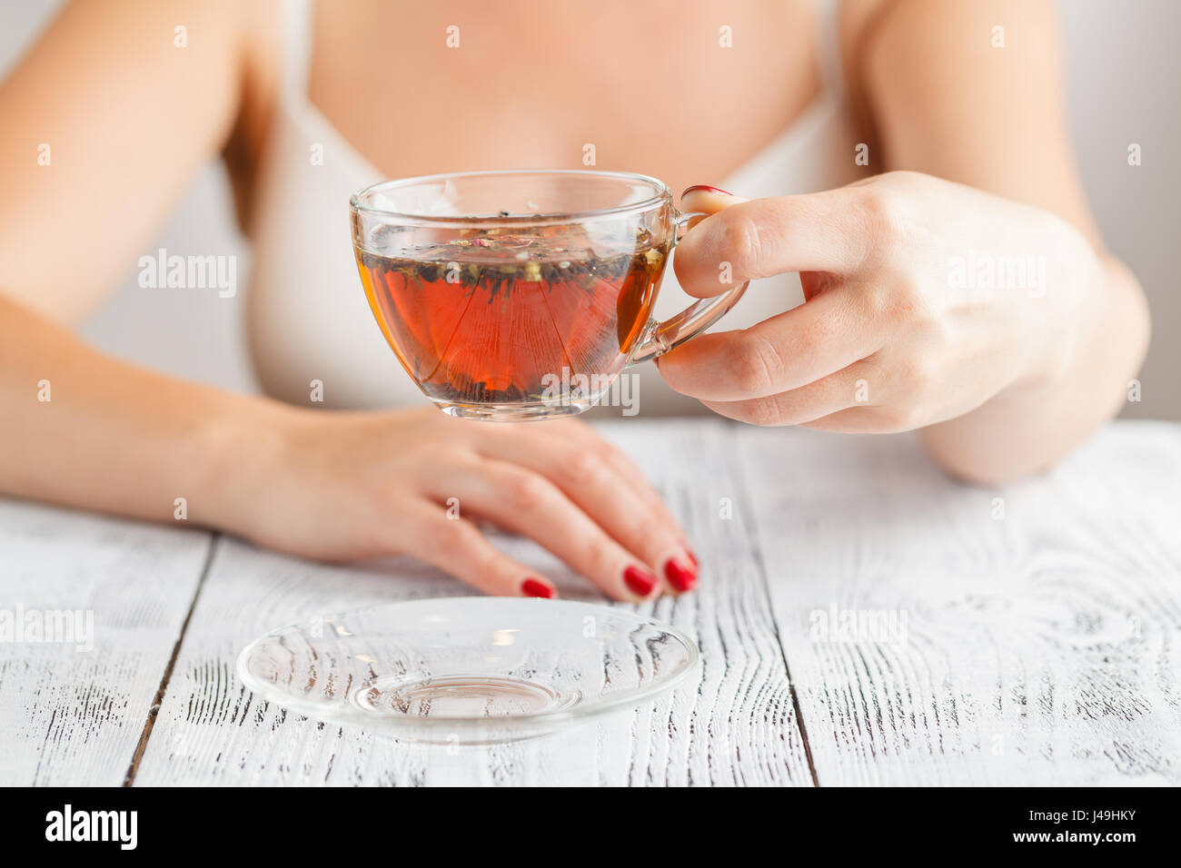 Hand holding cup of tea, close up Stock Photo - Alamy