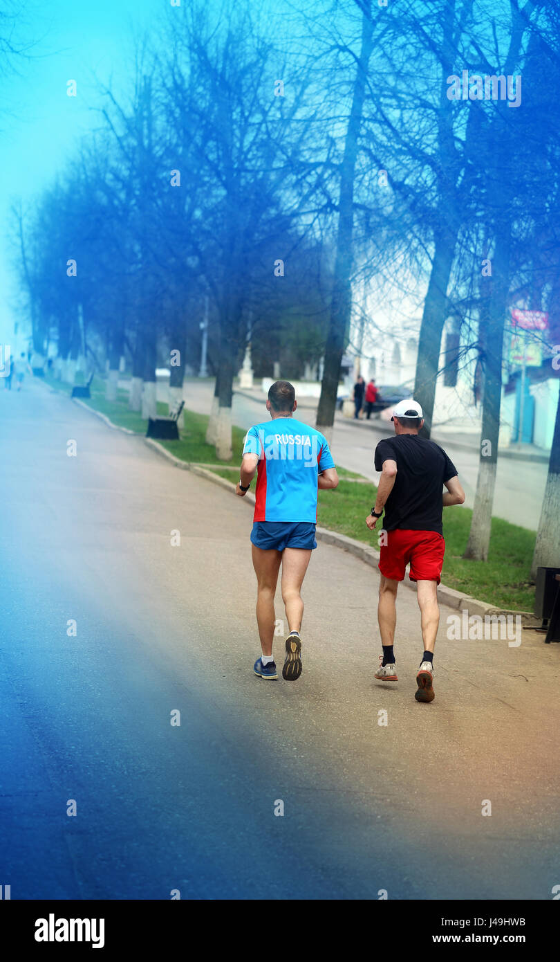 Two athletes running Stock Photo - Alamy