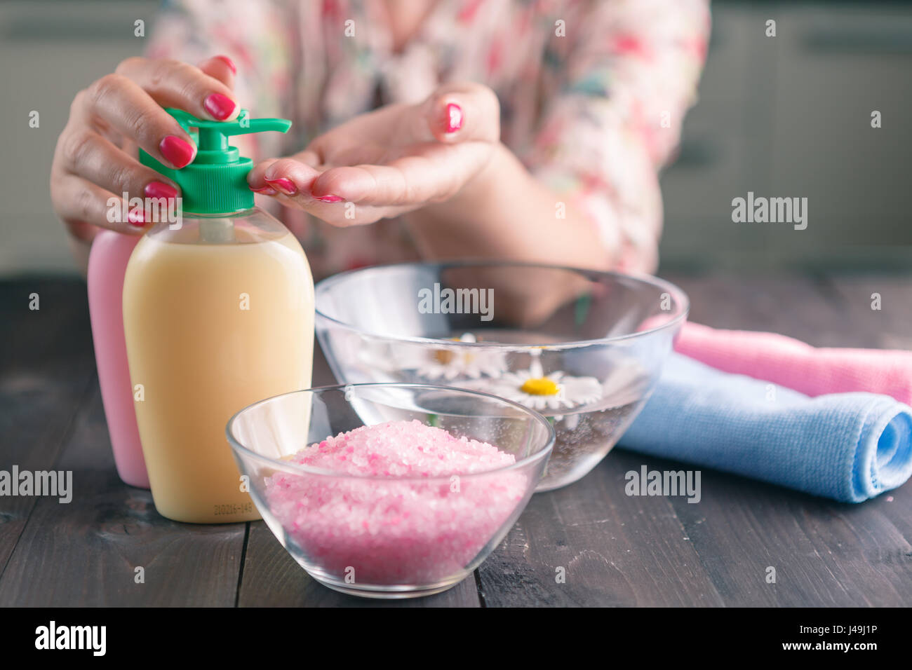 Female hands using liquid soap Stock Photo - Alamy