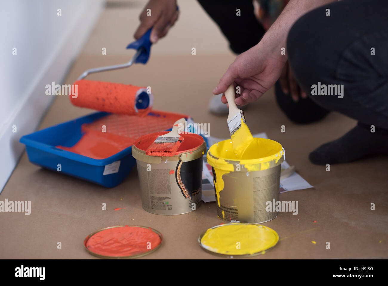 two painters prepare color for painting the wall Stock Photo - Alamy