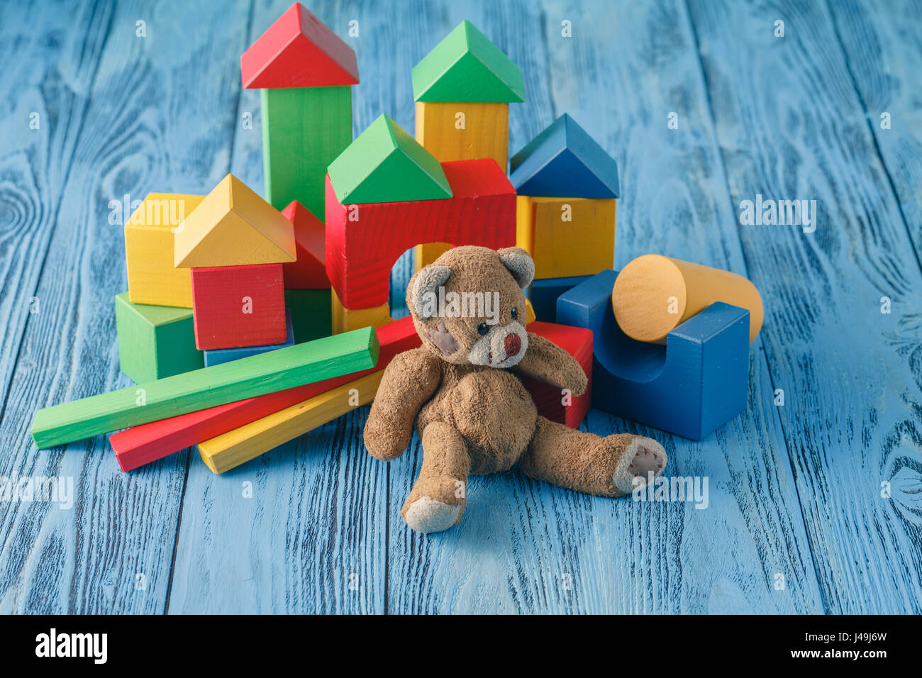 Toy bear and pile wooden building blocks Stock Photo - Alamy