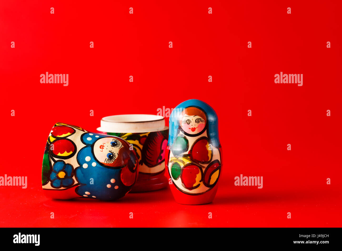Russian traditional matreshka on red background Stock Photo - Alamy