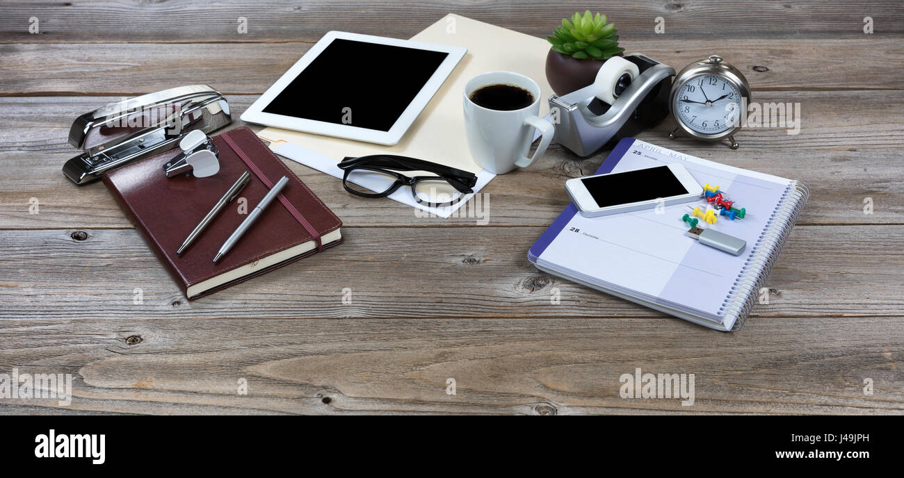 Front view of a working desktop on rustic wood setting Stock Photo - Alamy