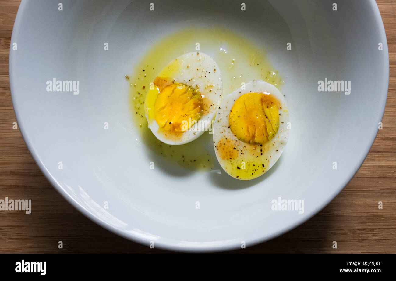A spicy hard-boiled egg, with olive oil, salt and pepper and a touch of ...