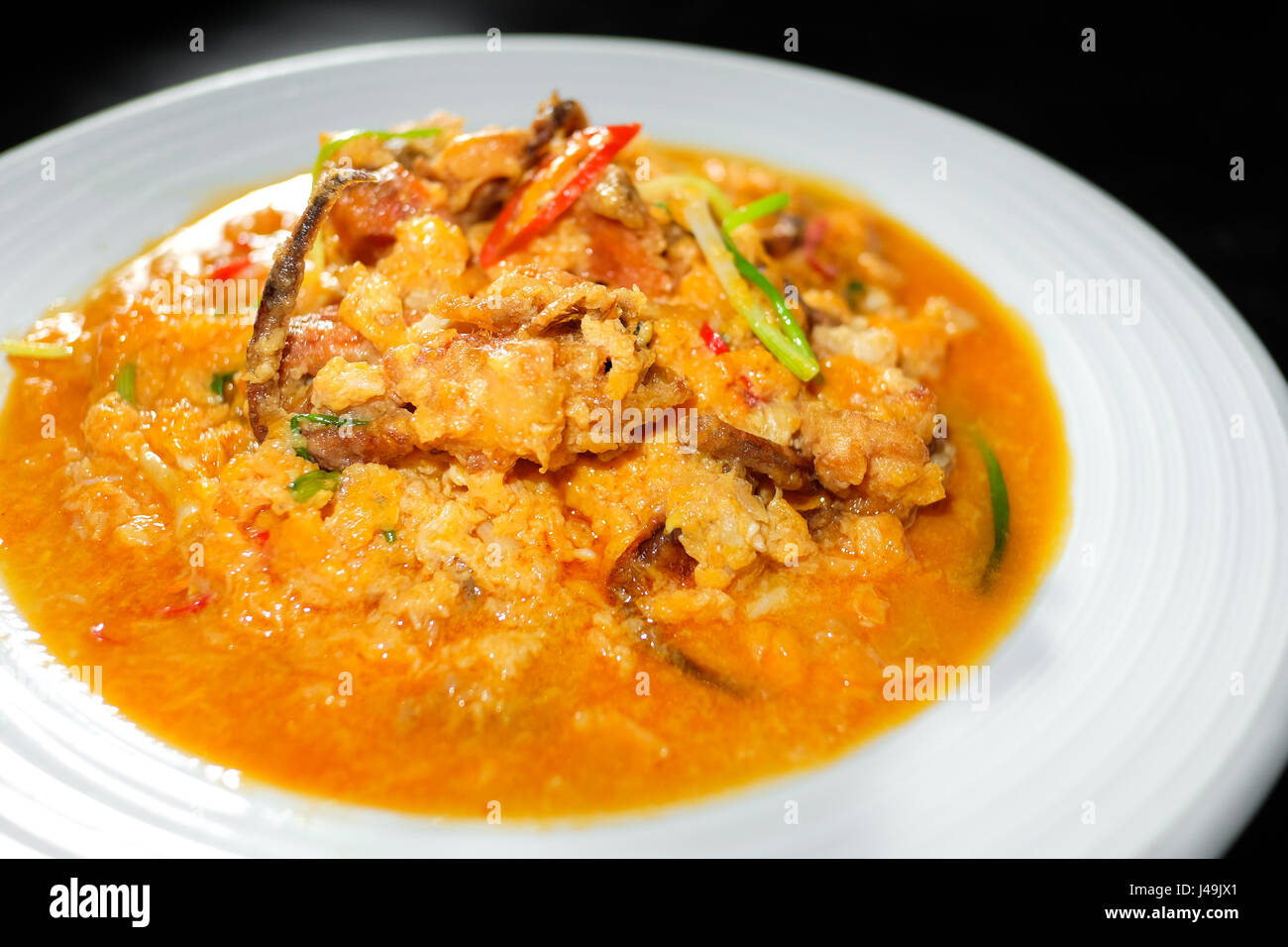 Seafood with Yellow curry sauce, sauteed seafood contains fish, shrimp ...