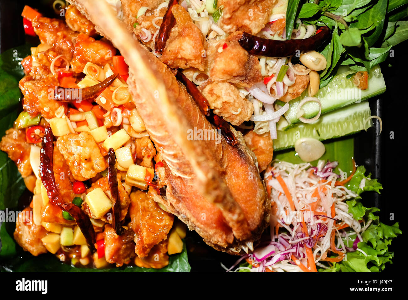 Thai Food,Fried fish with spicy toppings Stock Photo - Alamy