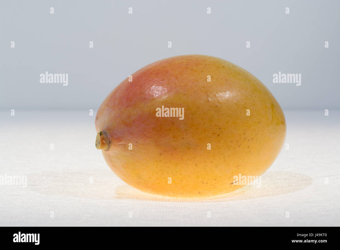 Two ripe organic golden yellow mangoes ready to eat close up Stock ...