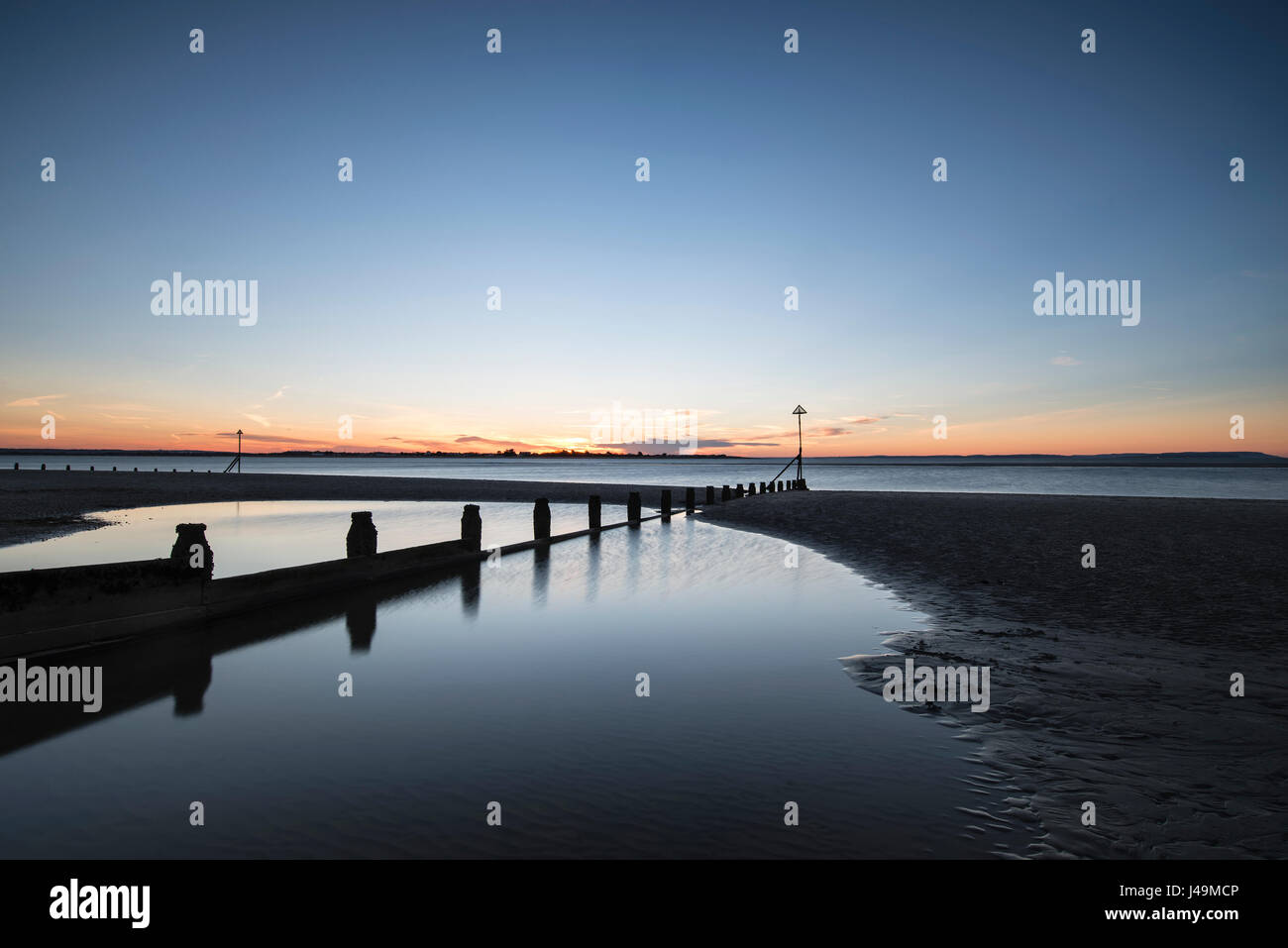 Beautiful Spring sunset long exposure beach landscape Stock Photo - Alamy
