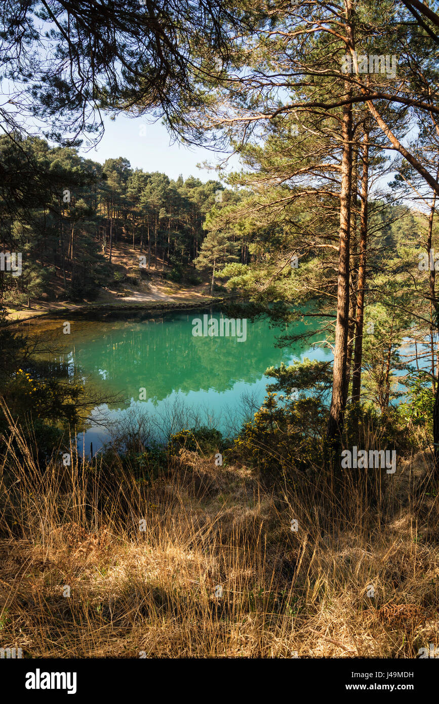 Beautiful landscape image of old clay pit quarry lake with unusual ...