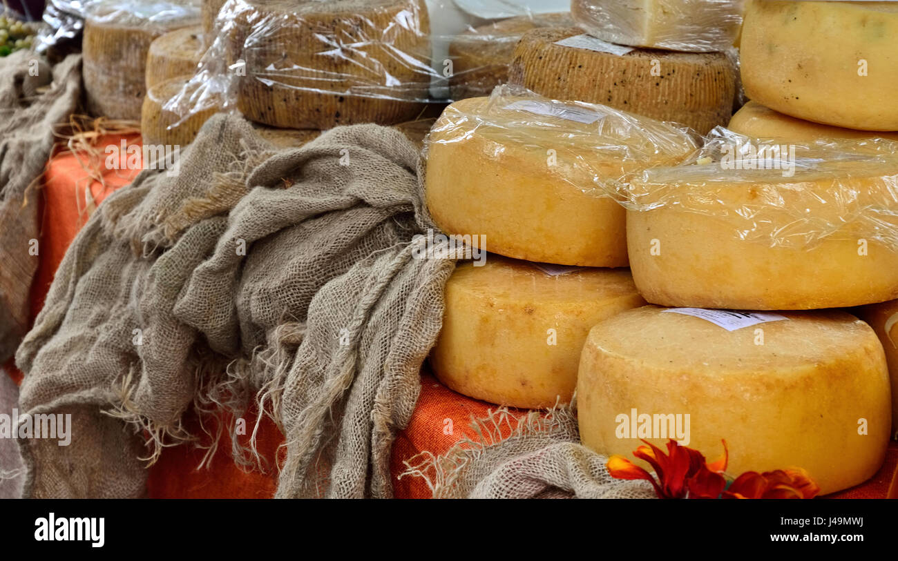 Italian traditional cheese on display at farmer's market Stock Photo ...