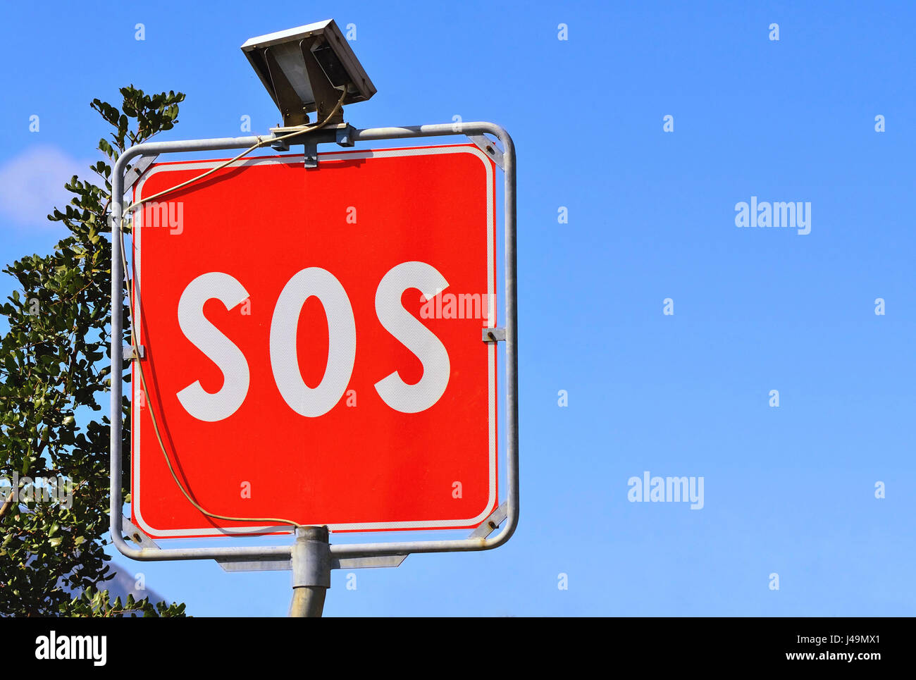 SOS sign a blue sky background Stock Photo - Alamy