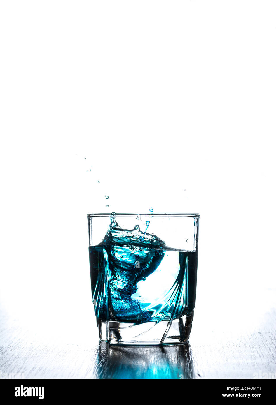 water splash in glass isolated on white Stock Photo - Alamy