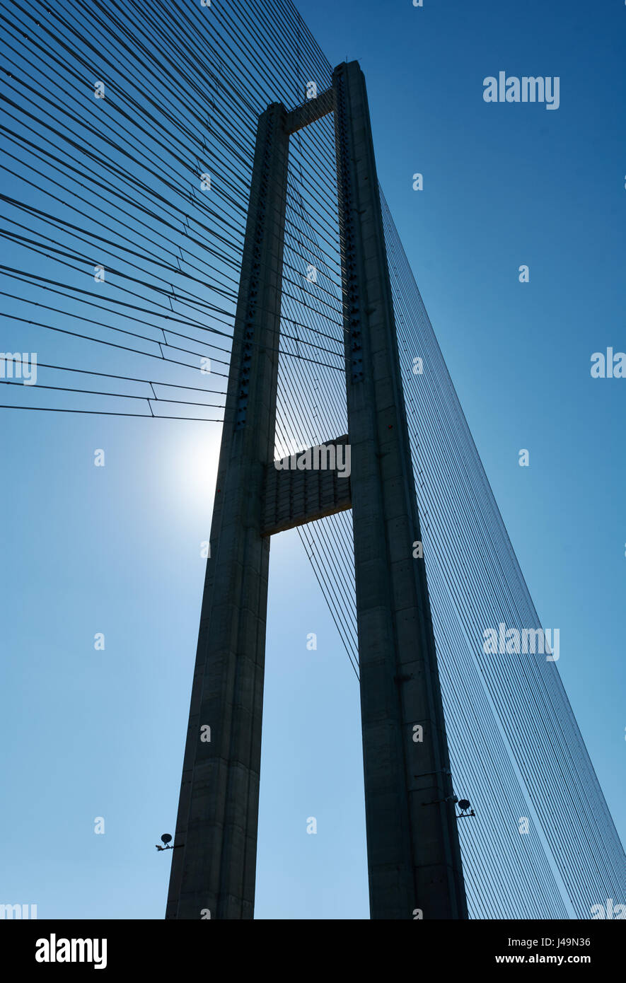 Modern bridge pylon against a blue sky Stock Photo - Alamy