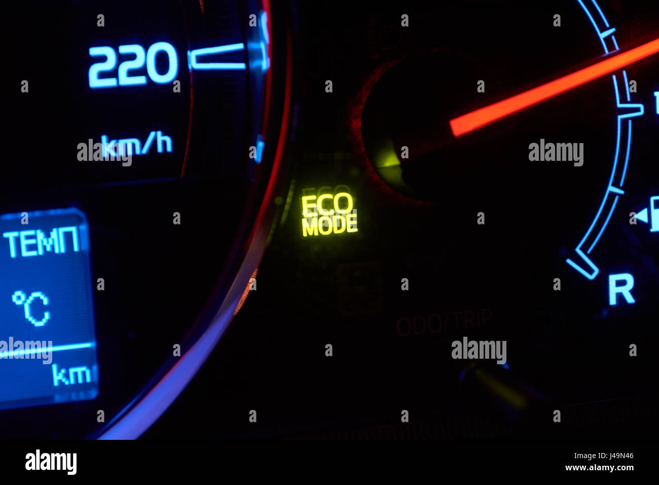 Close up of car dashboard with green hybrid mode icon on Stock Photo ...