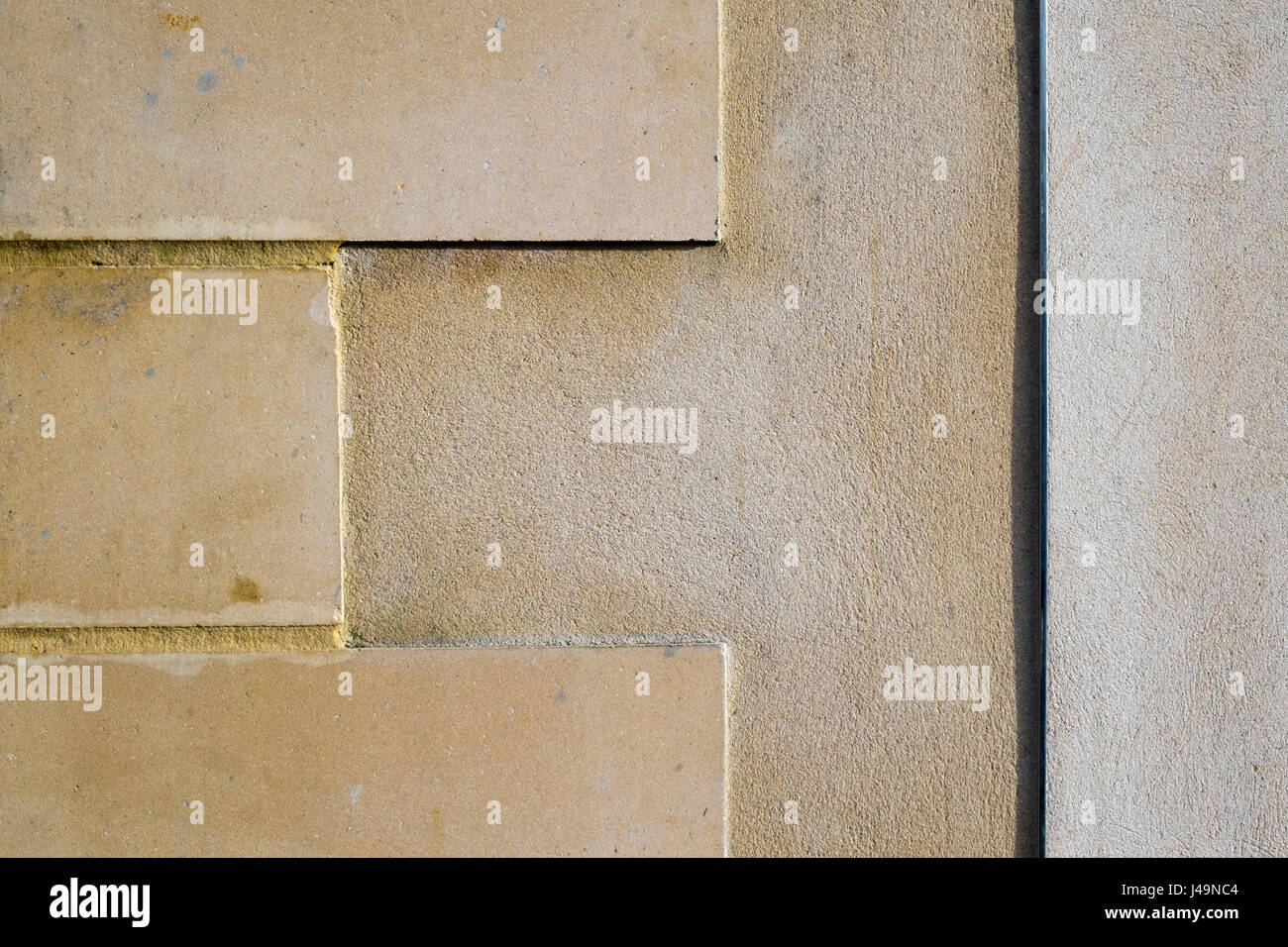 Dressed stone and render exterior wall detail full frame background ...