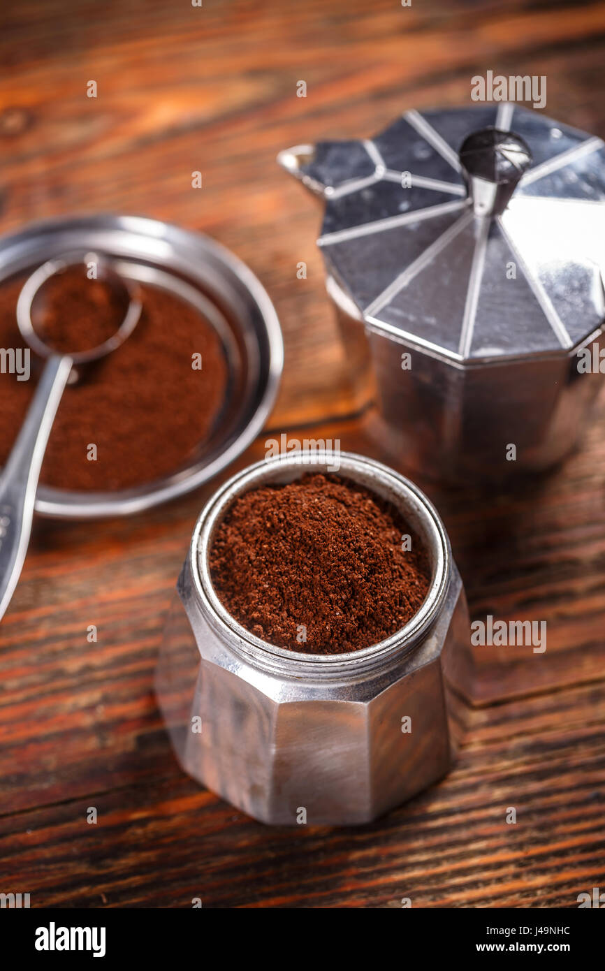 Old coffee maker in vintage style on wooden background Stock Photo - Alamy