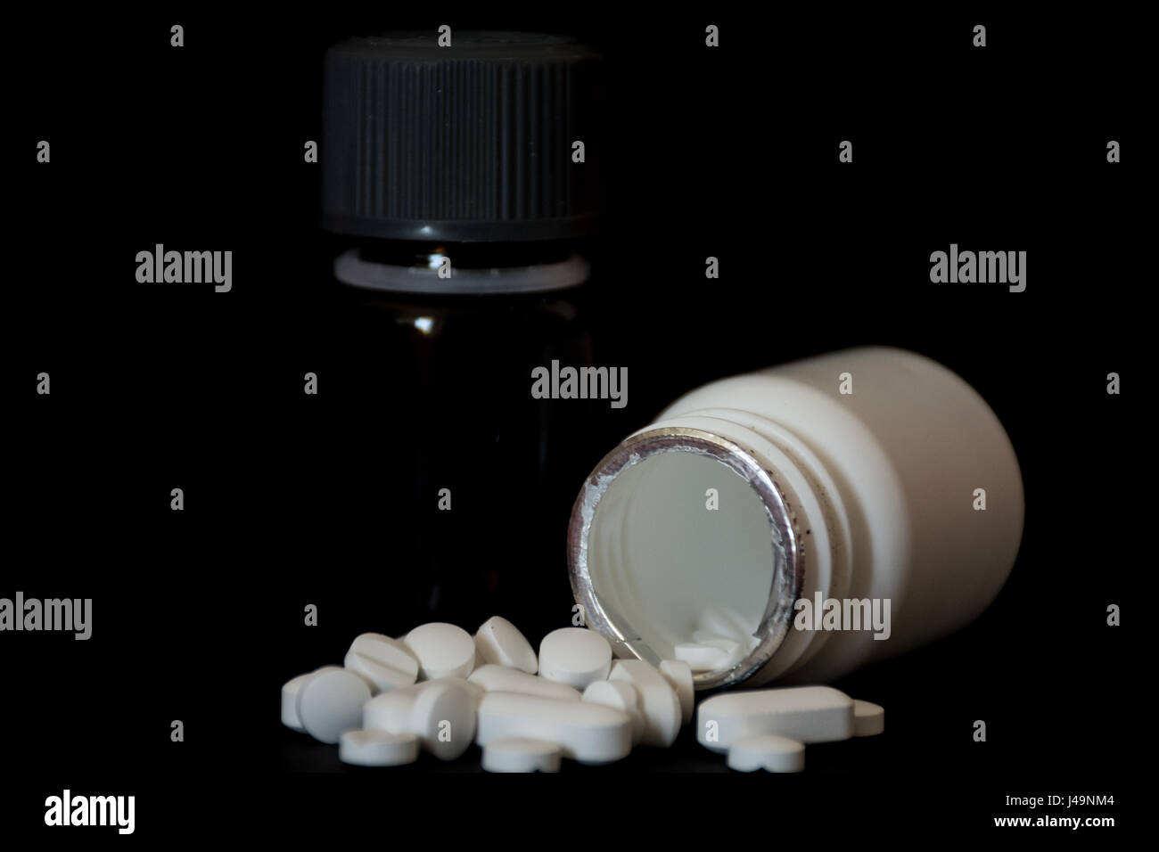 Illegal drugs on black background Stock Photo - Alamy