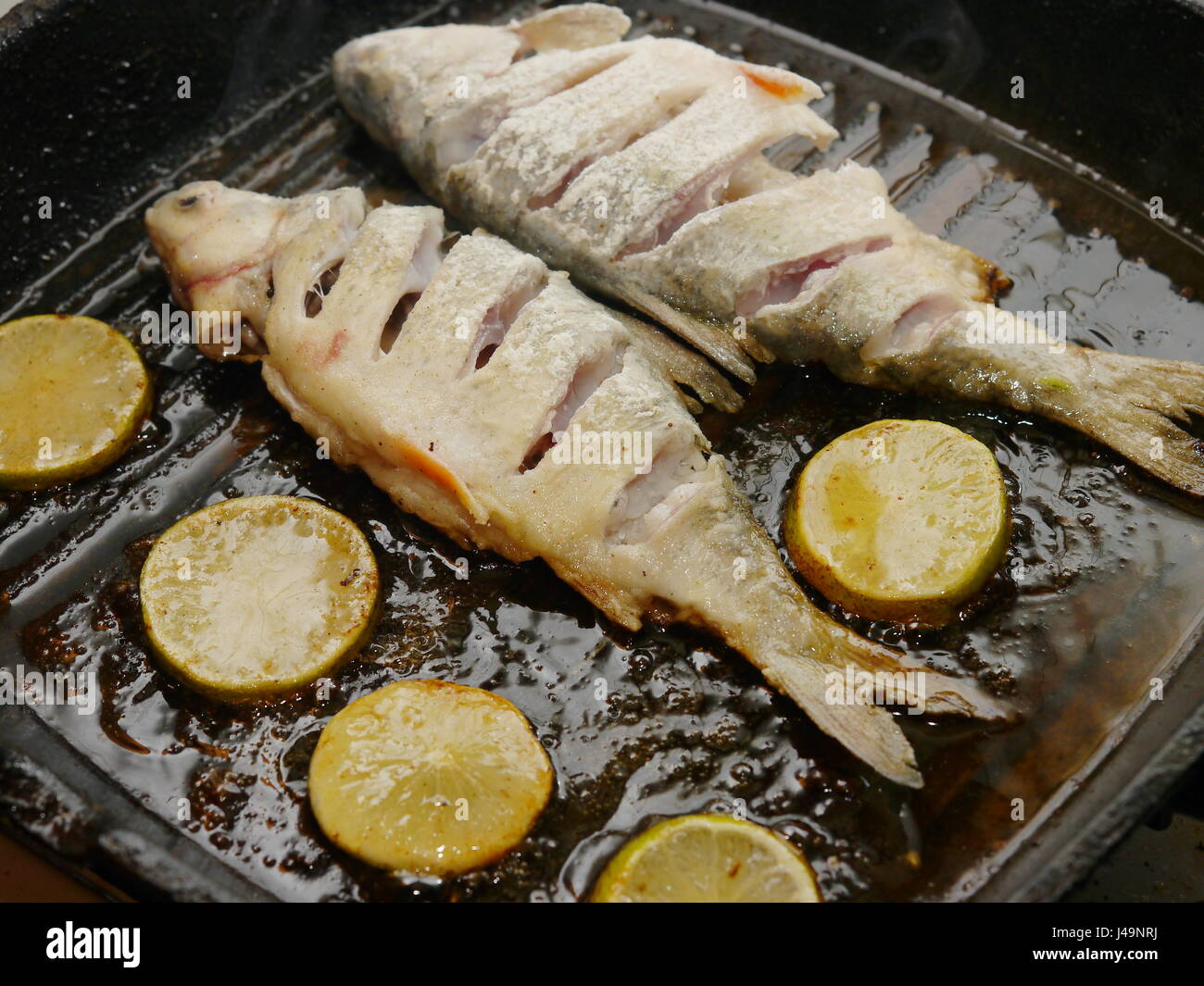 Salmon frying pan crispy skin hi-res stock photography and images - Alamy