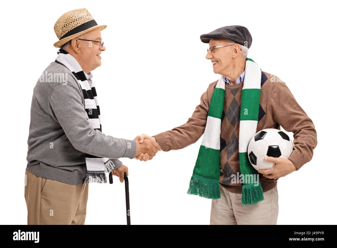 Two elderly football fans shaking hands isolated on white background ...