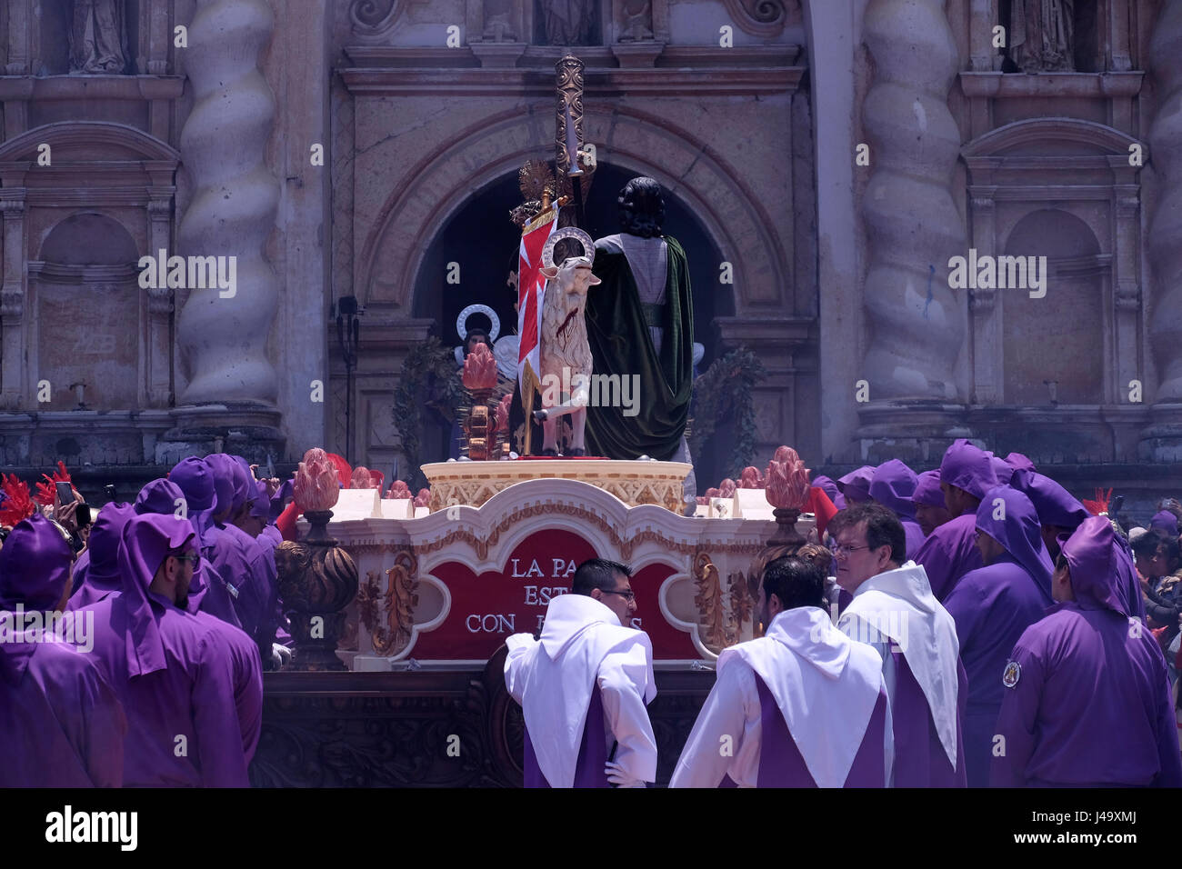 Churchmen dressed in purple robes carry the Anda (Float) of Jesus ...