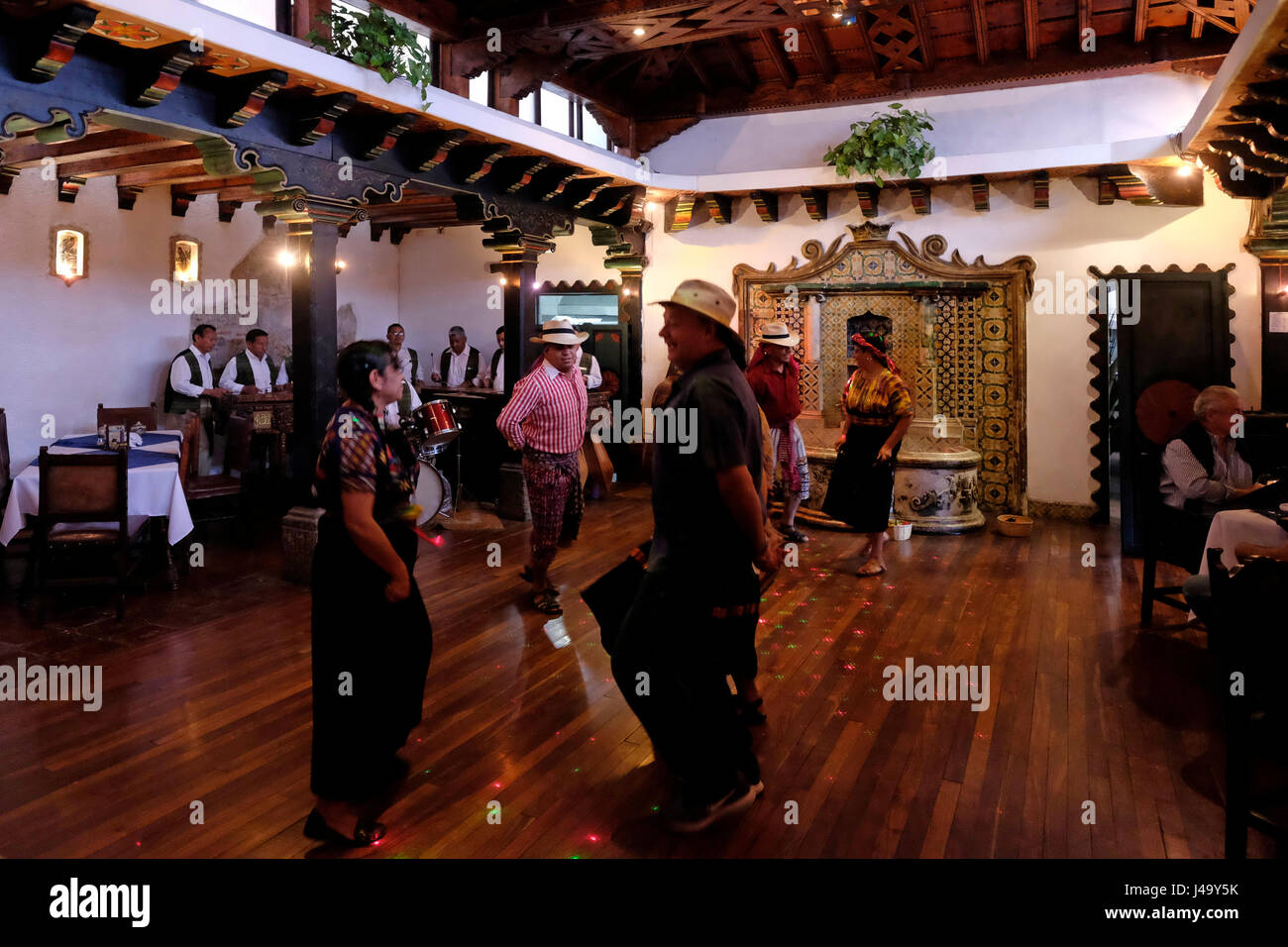 Tourists dancing traditional Guatamalan dances with locals in the ...