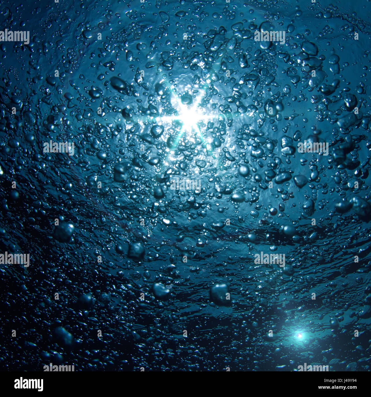 Abstract blue underwater background. Water surface with sunlight small ...