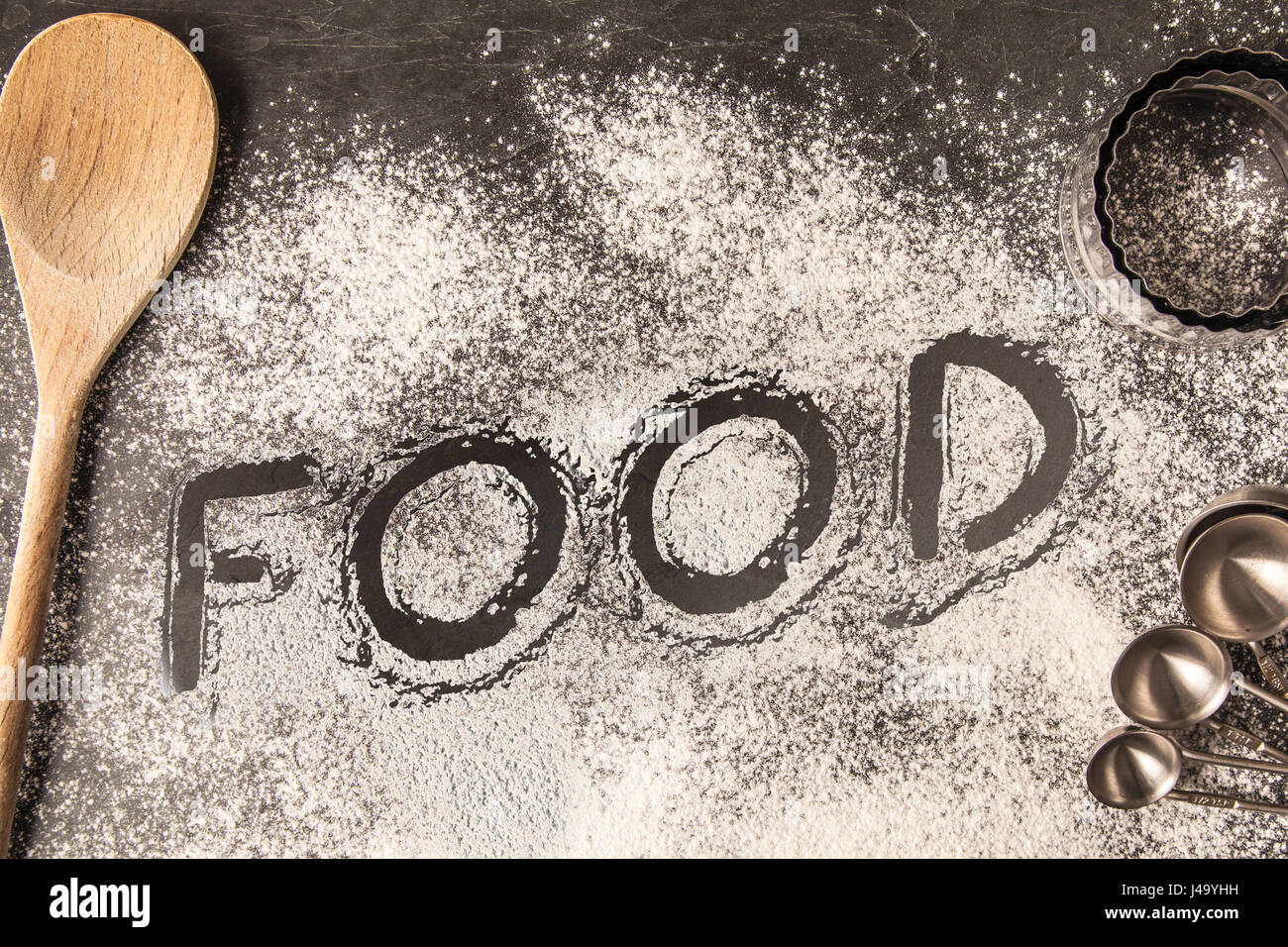 Handwritten word drawn in the flour - food Stock Photo - Alamy