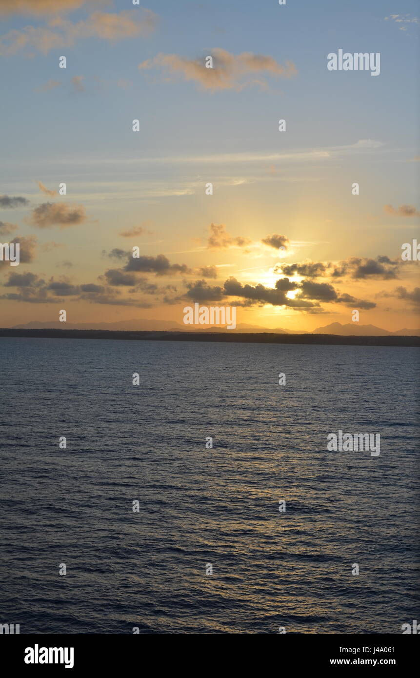 Sunset on the continent. Sunset on the mainland seen from cruise ship ...
