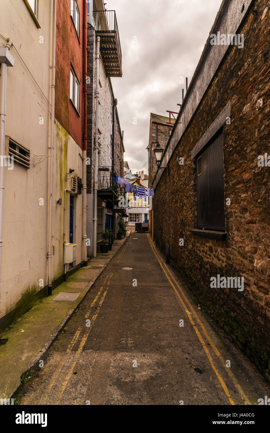Narrow passage from the back of buildings in seaside town, old ...