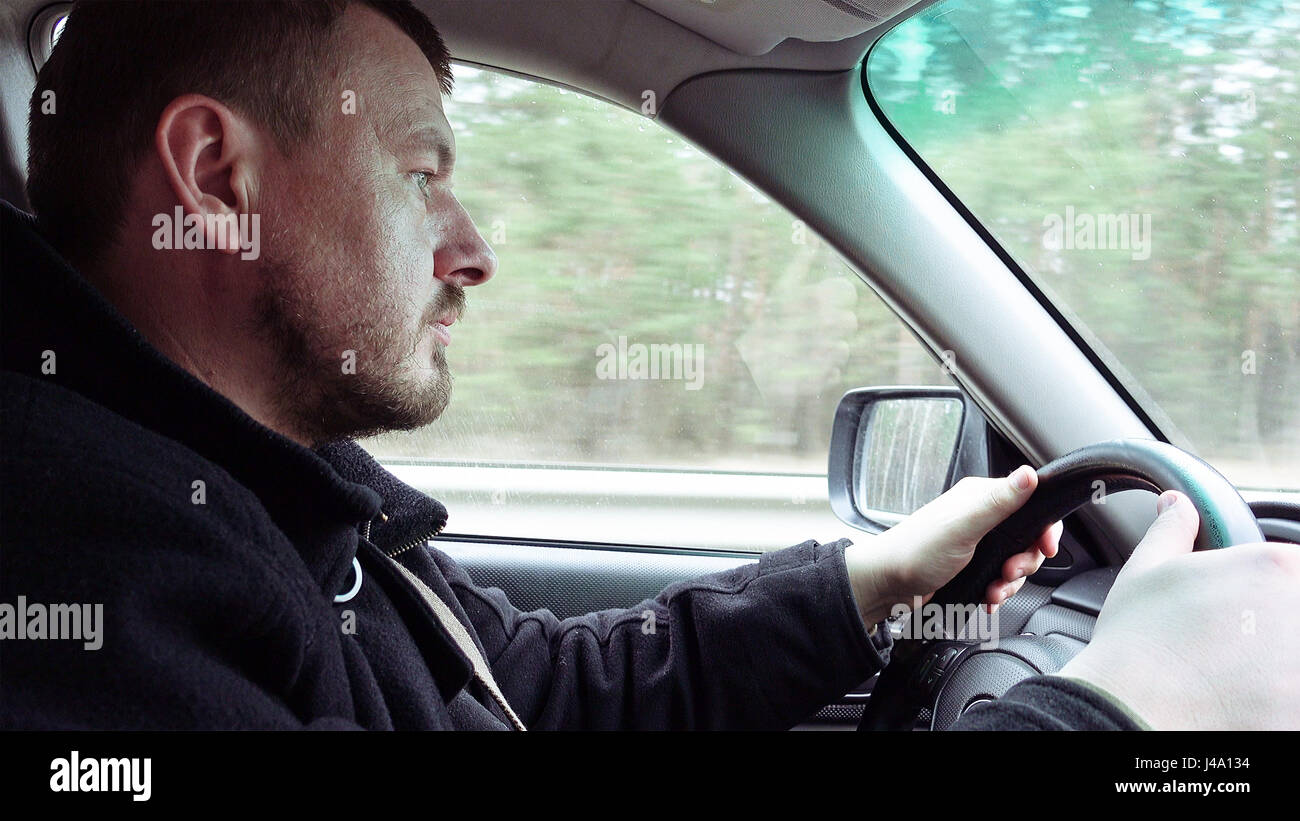 Man drives a car on a highway Stock Photo - Alamy