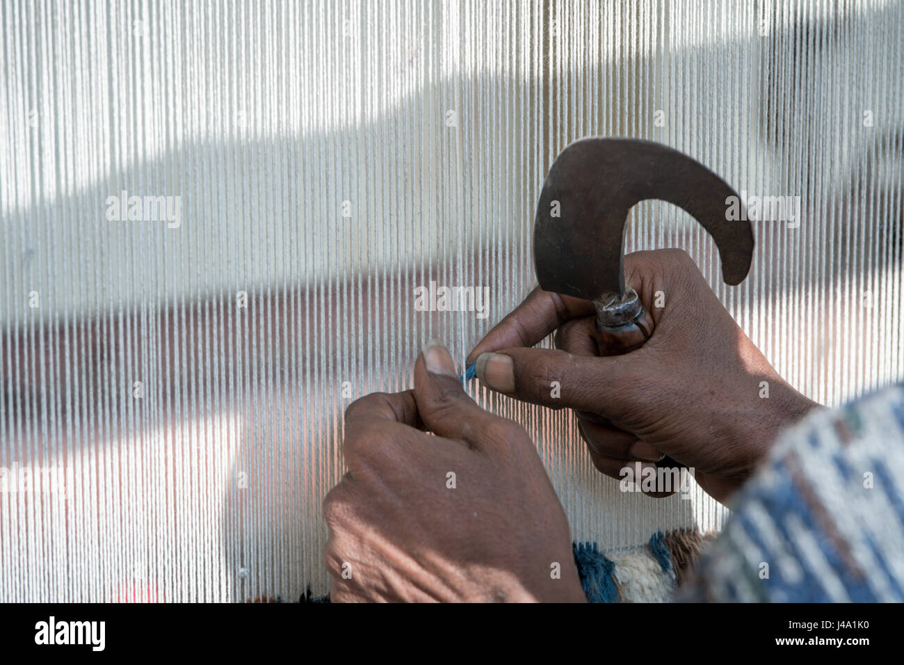 Jaipur, India - Indian person weaving thread Stock Photo - Alamy