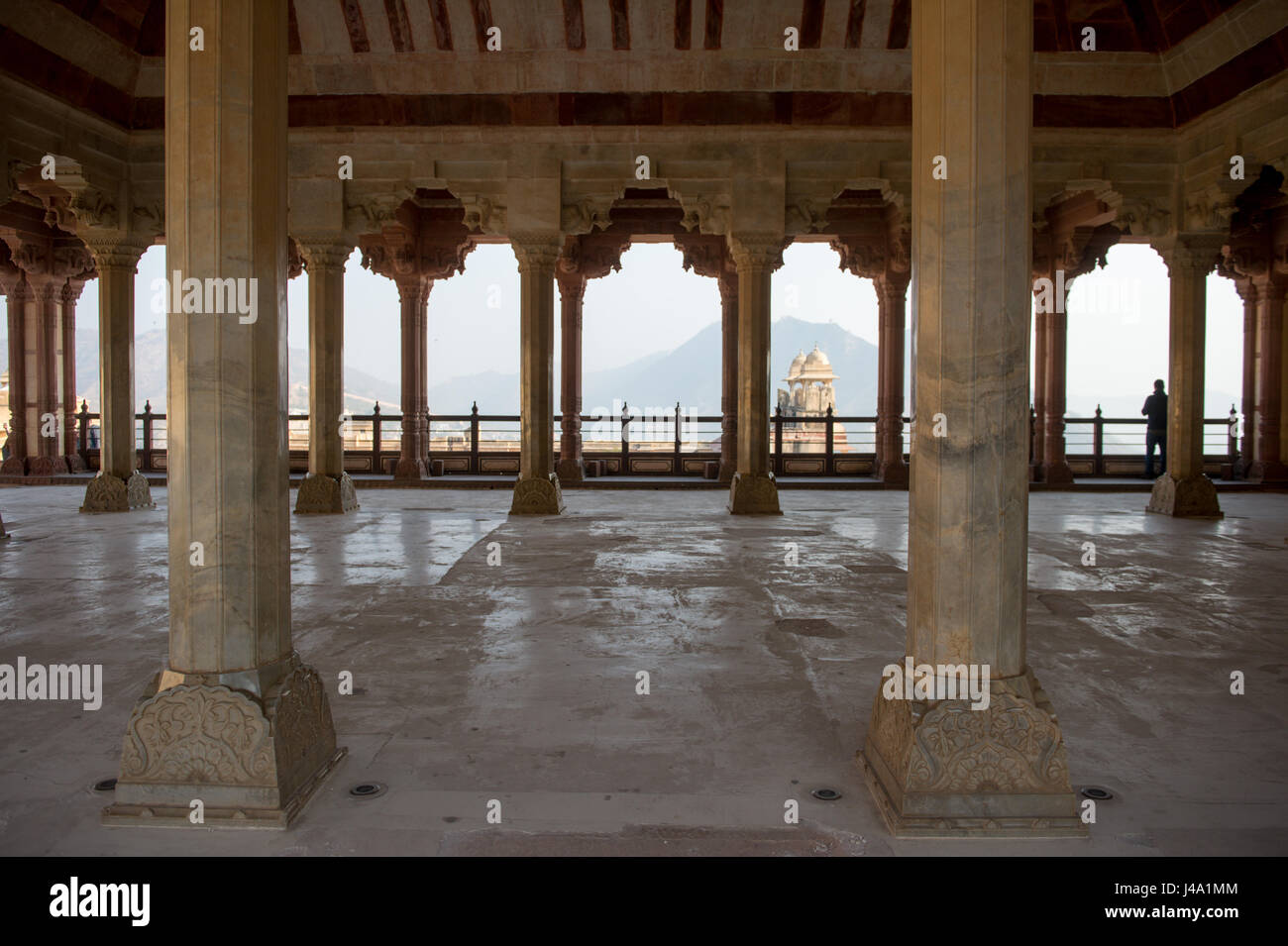 Stone columns of the Amer Fort overlooking mountains in Jaipur, India ...