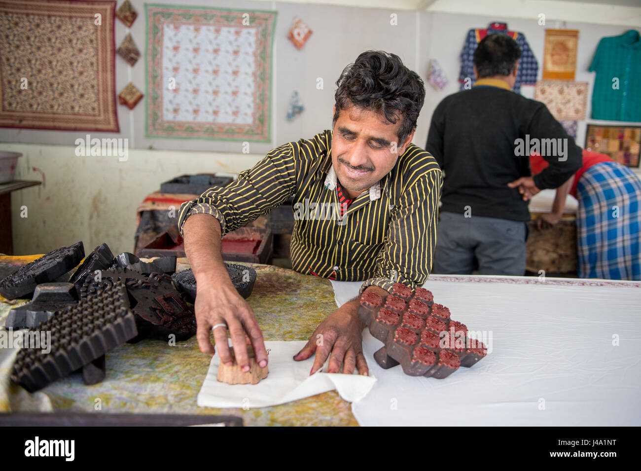 Indian man stamping pattern on fabric in a shop in Jaipur, India Stock ...